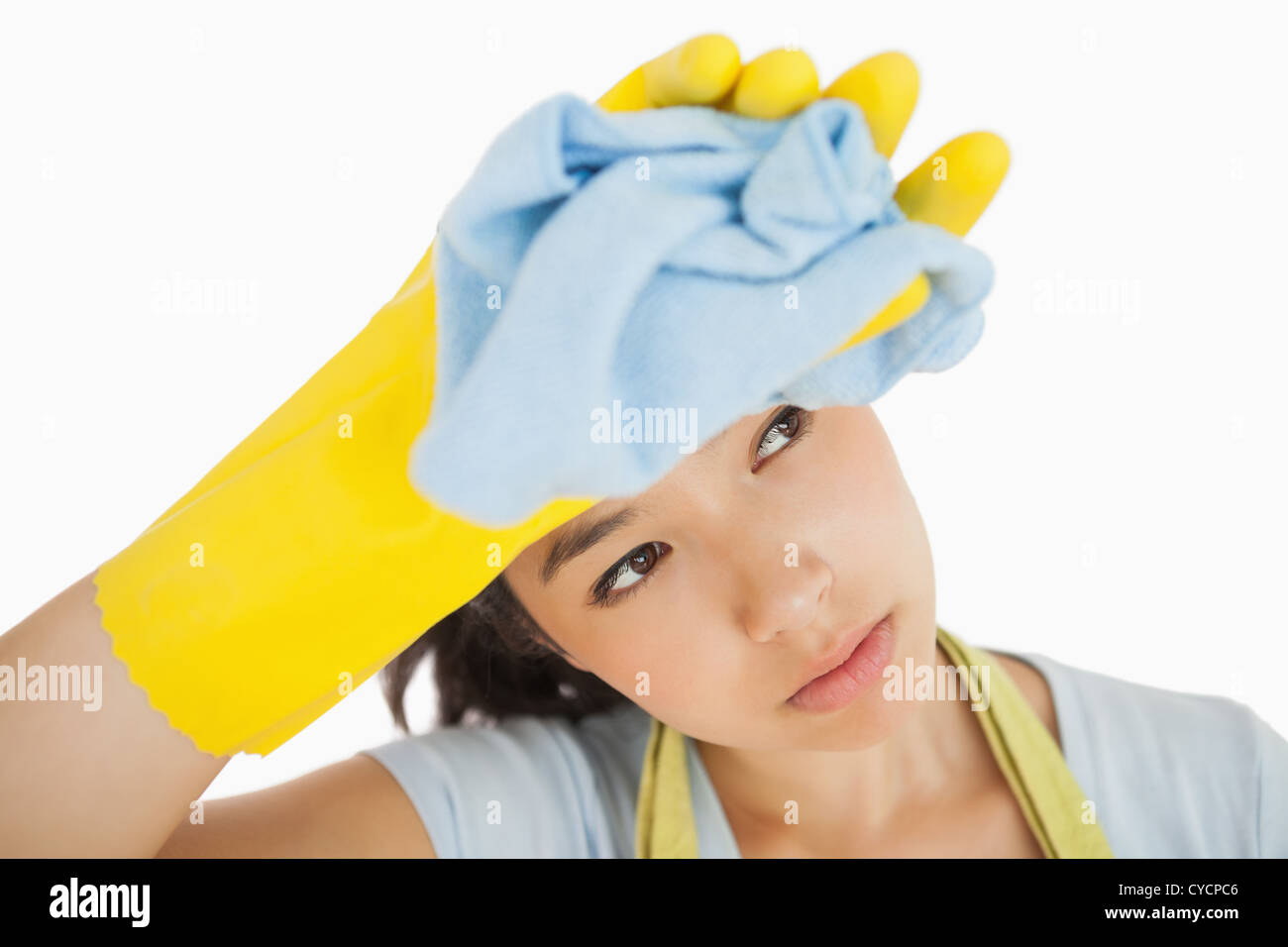 Overworked cleaning lady wiping her brow Stock Photo - Alamy