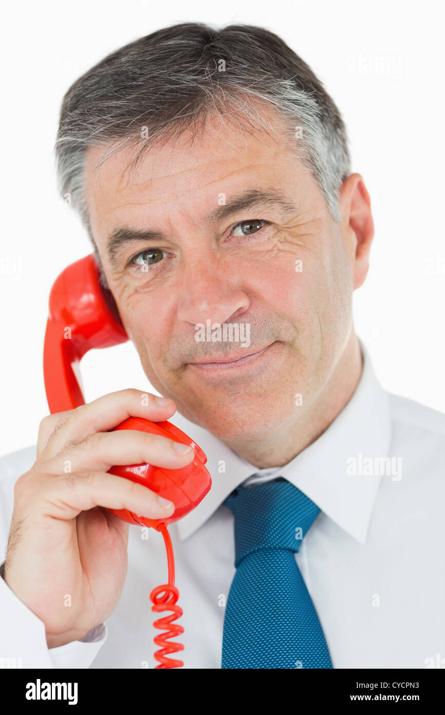 Smiling man using the phone Stock Photo - Alamy