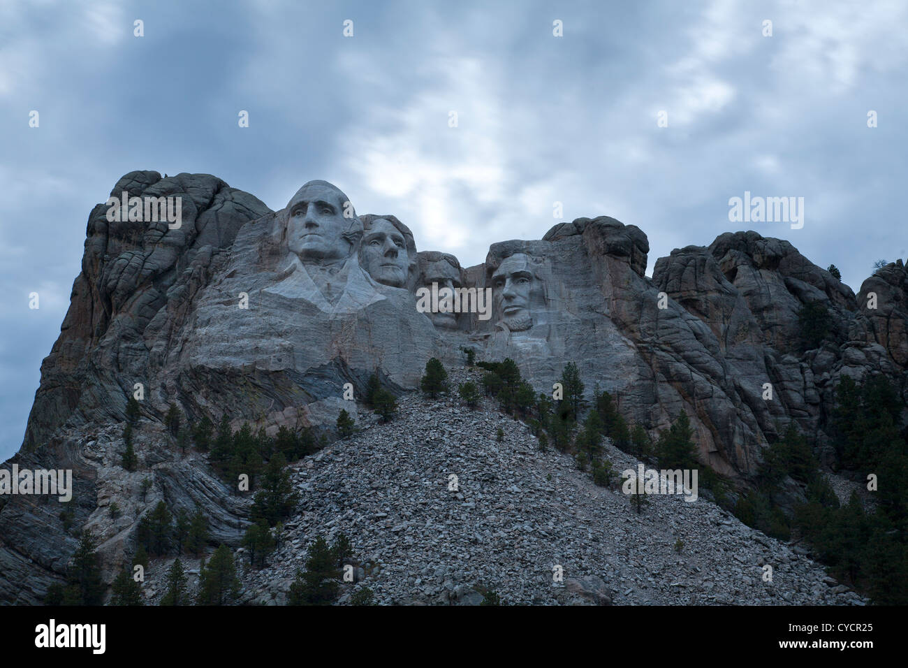 The granite faces of Mount Rushmore National Memorial at dusk in South ...