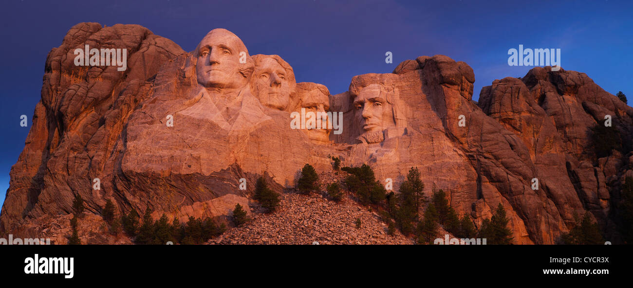 The granite faces of Mount Rushmore National Memorial at sunrise in ...