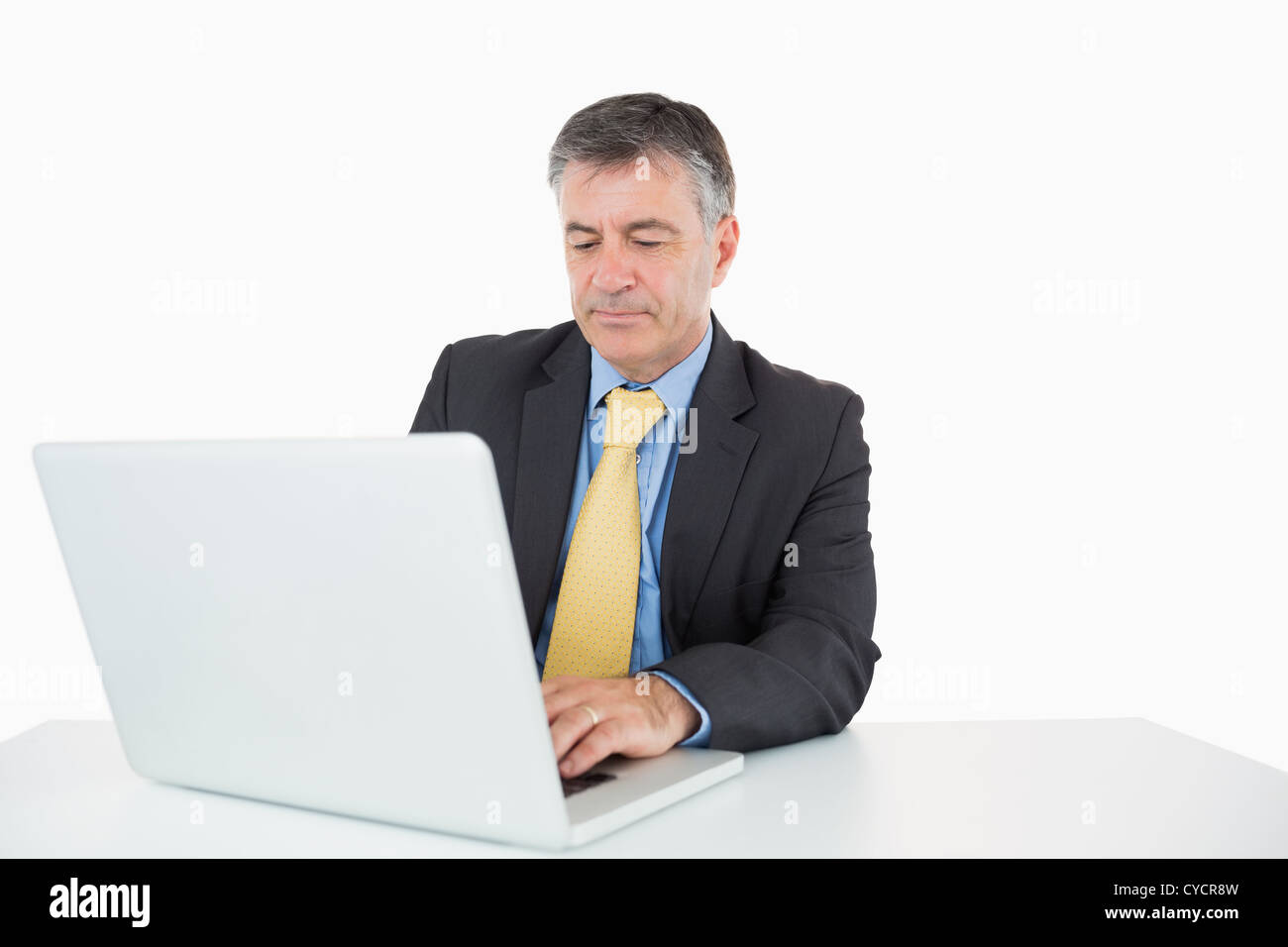 Man writing on his laptop Stock Photo - Alamy