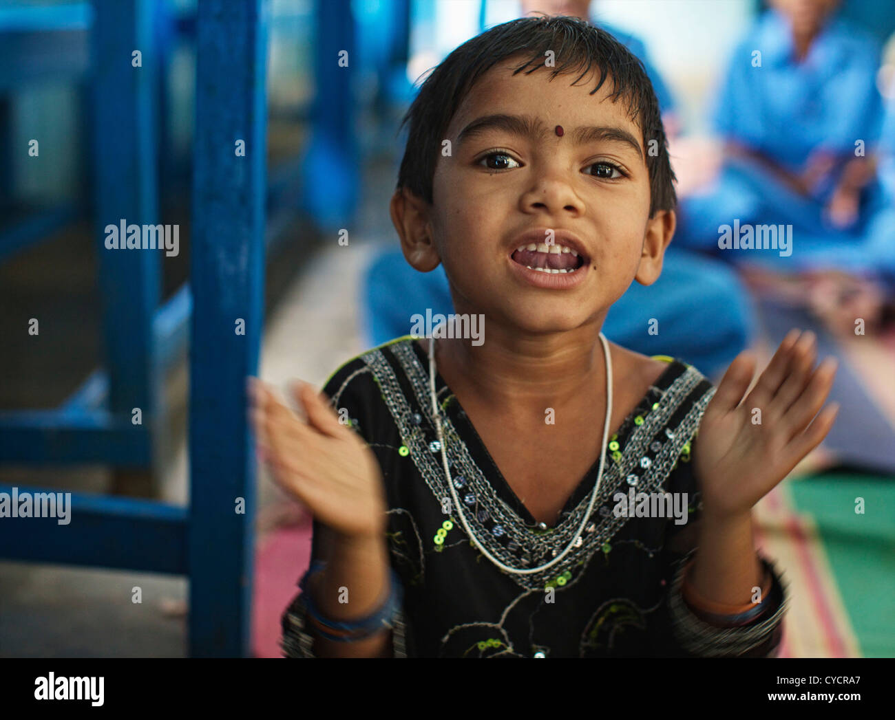 Young Indian girl clapping her hands Stock Photo - Alamy
