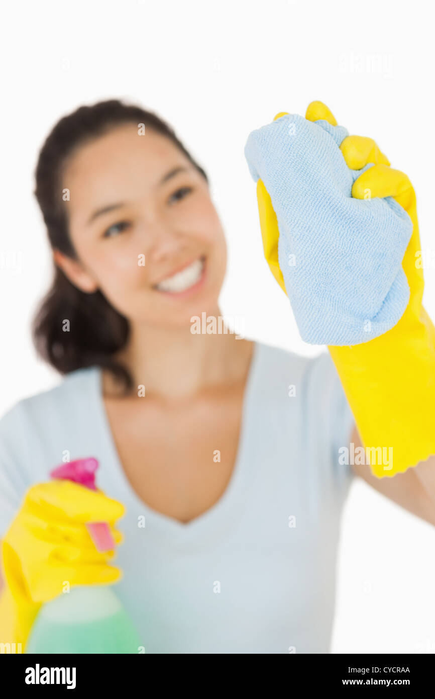 Happy woman cleaning a window Stock Photo - Alamy