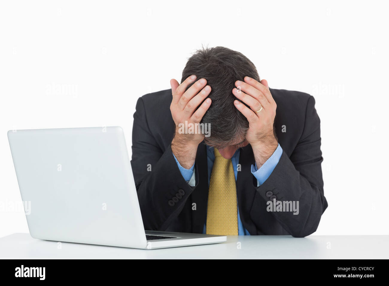 Frustrated businessman with laptop Stock Photo - Alamy