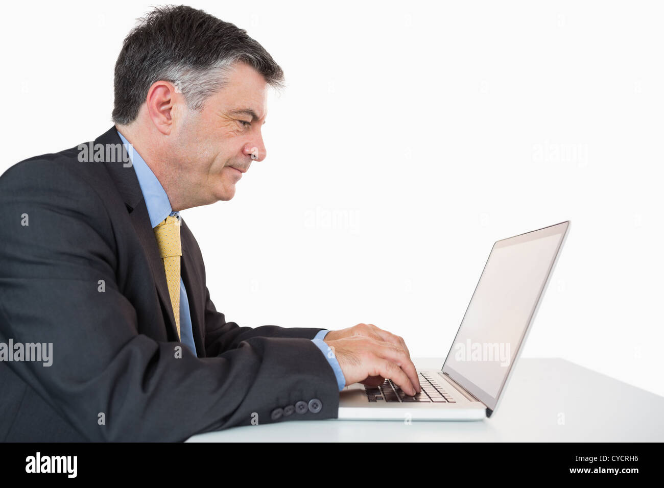 Man writing on his laptop Stock Photo - Alamy