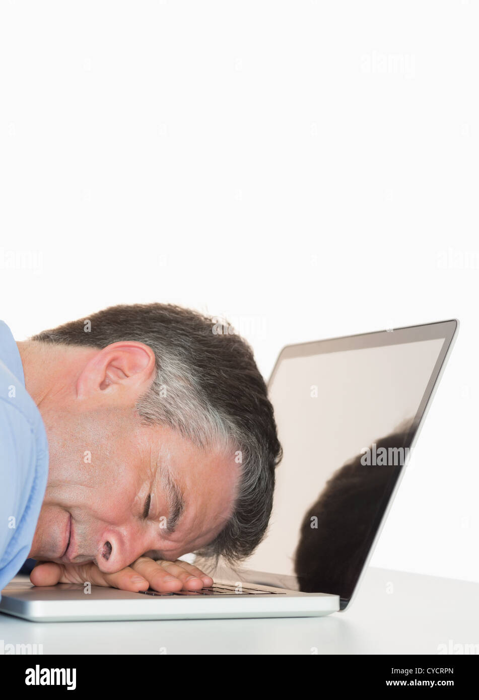 Exhausted man sleeping on his laptop Stock Photo - Alamy