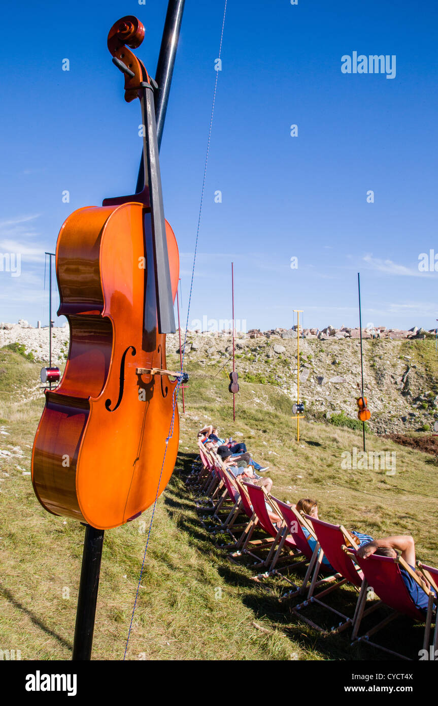 An audience in deck chairs listening to aeolian music from various ...