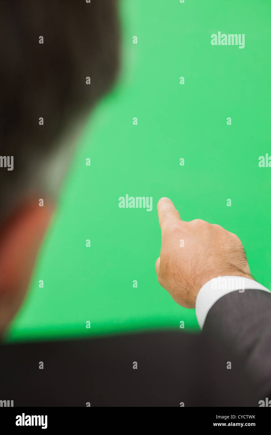 Man pointing to green screen Stock Photo - Alamy