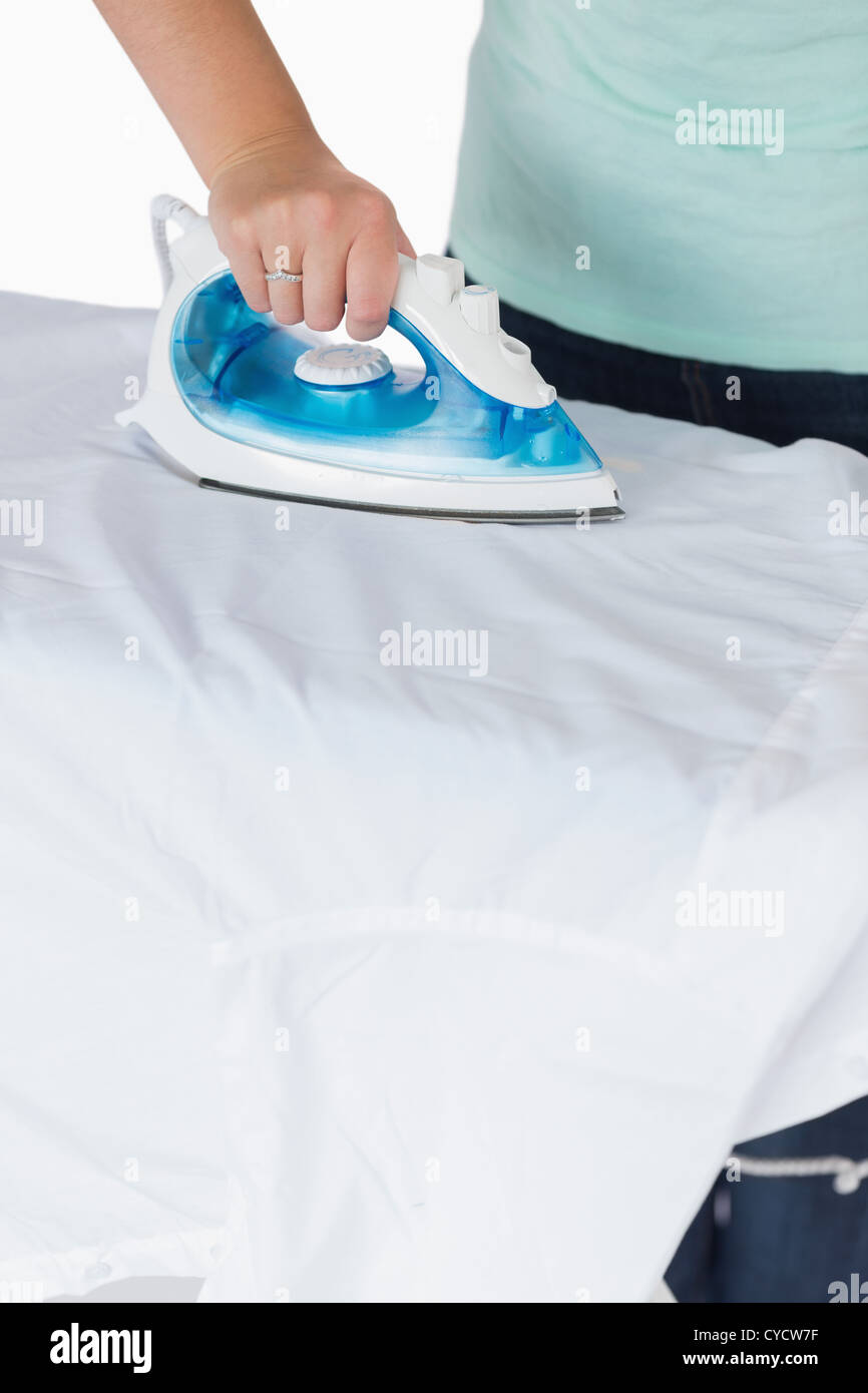 Woman ironing clothes Stock Photo - Alamy