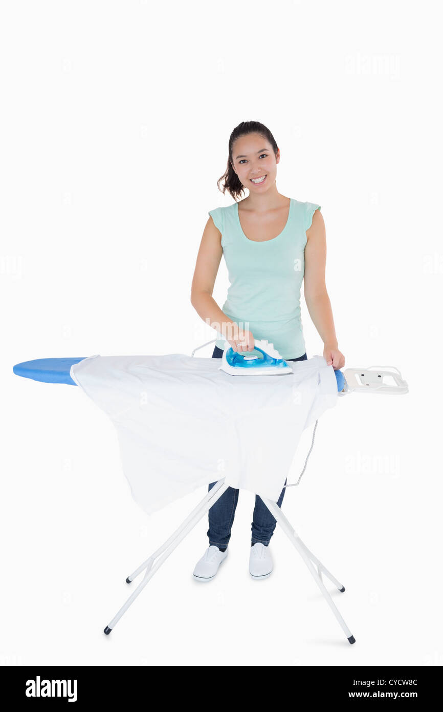Woman doing housework ironing Cut Out Stock Images & Pictures - Alamy