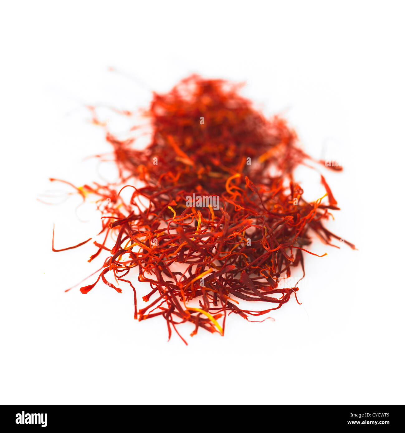 Saffron strands on white background Stock Photo - Alamy