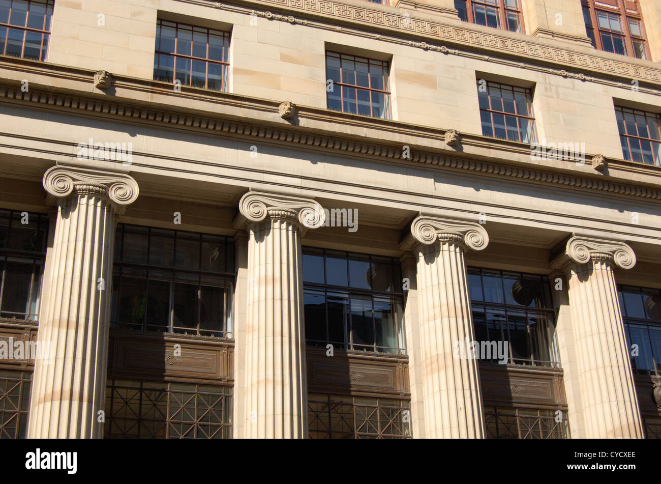 Columns on the facade of sanstone city centre building in Glasgow ...