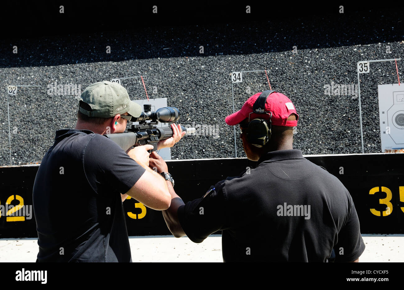 Gunman test firing automatic rifle at the FBI shooting range in Chicago ...