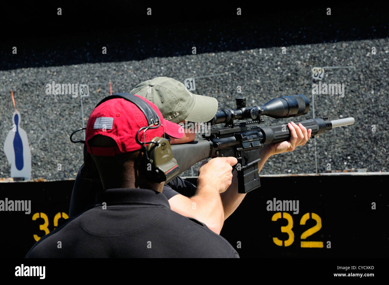 Gunman test firing automatic rifle at the FBI shooting range in Chicago ...