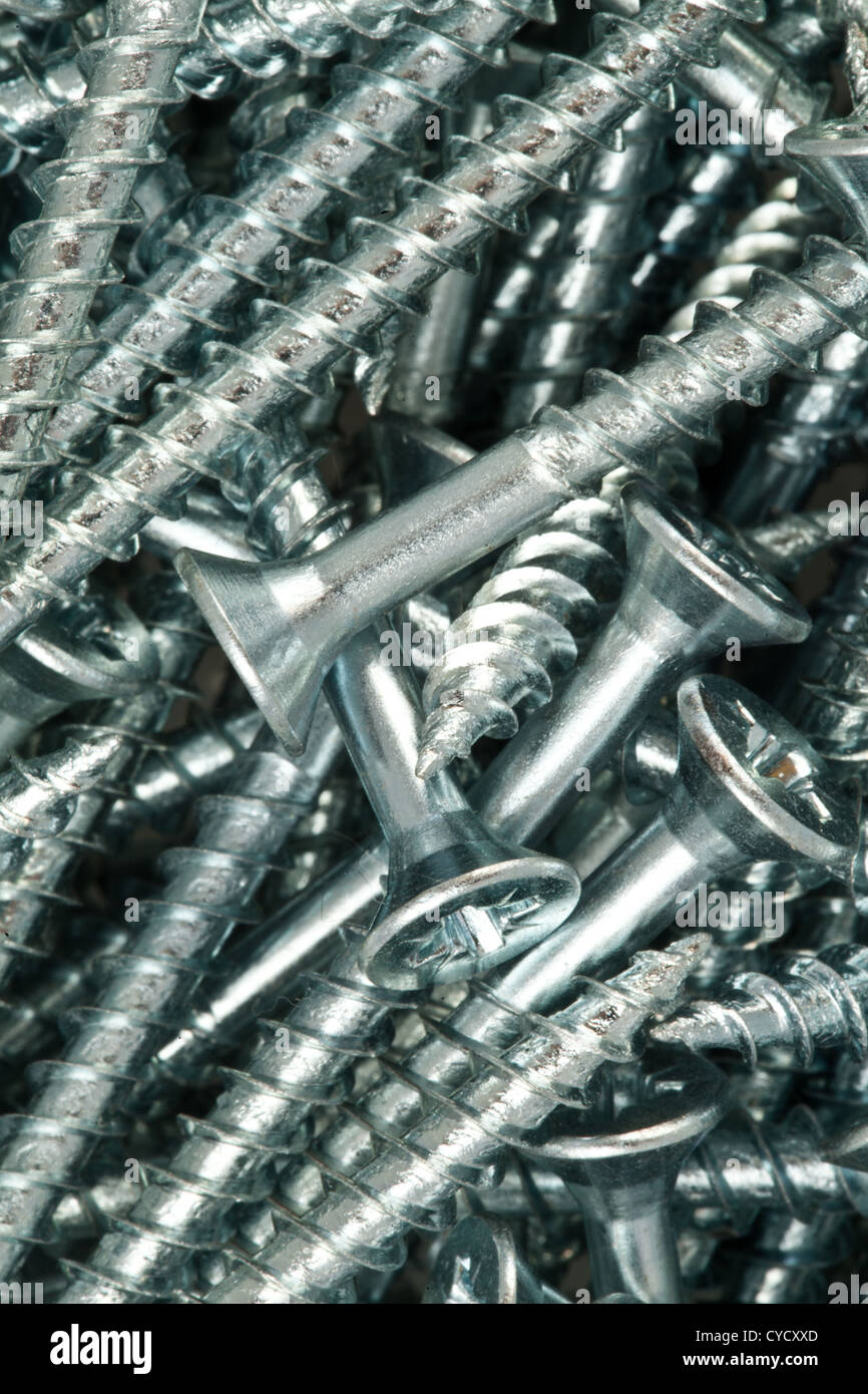 Many silver screws Stock Photo - Alamy