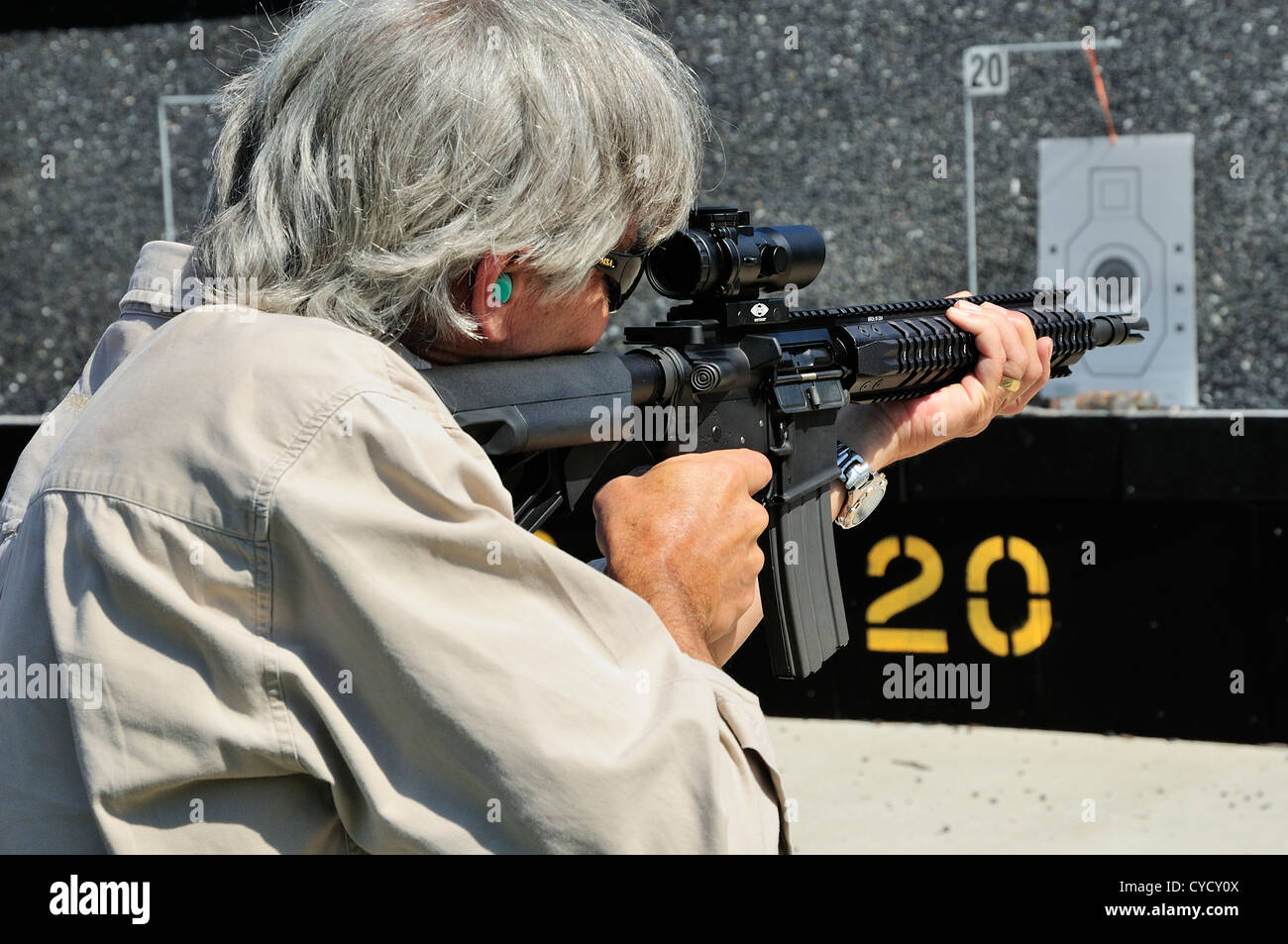 Gunman test firing automatic rifle at the FBI shooting range in Chicago ...