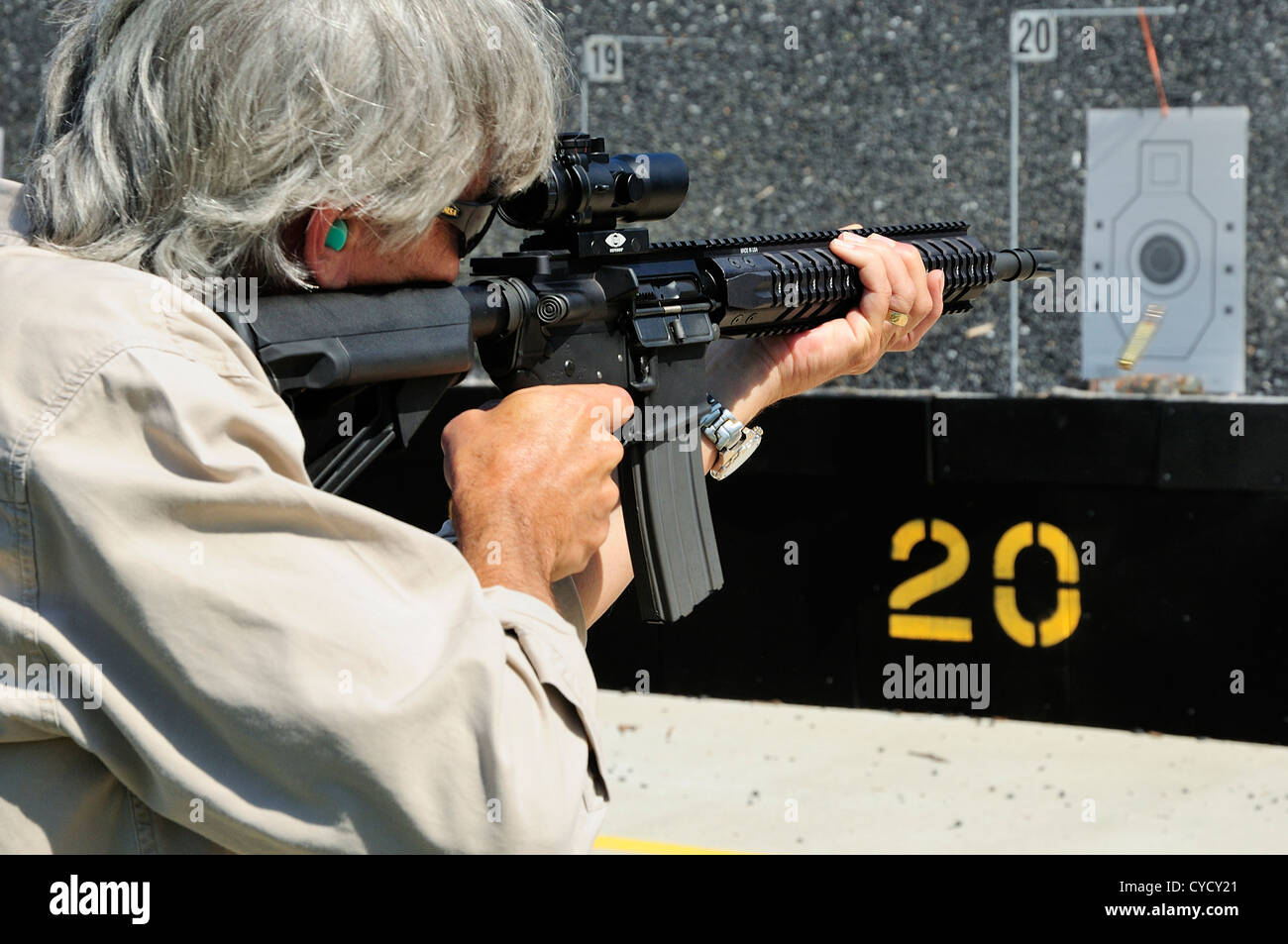 Gunman test firing automatic rifle at the FBI shooting range in Chicago ...