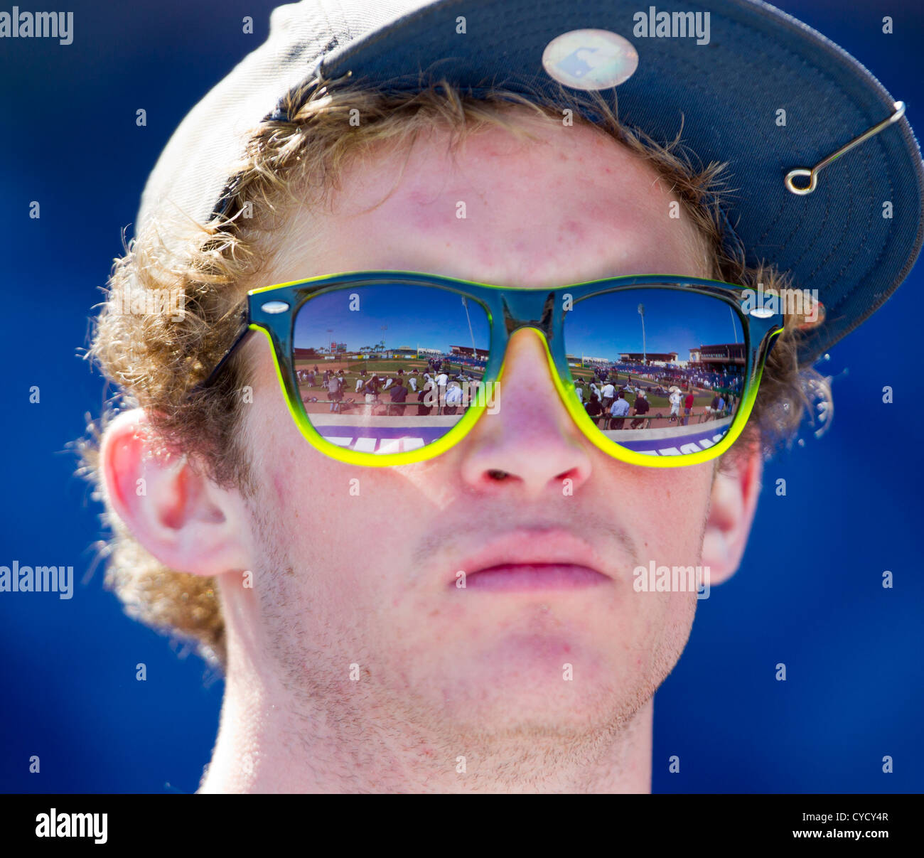 A baseball fan wearing sunglasses Stock Photo - Alamy