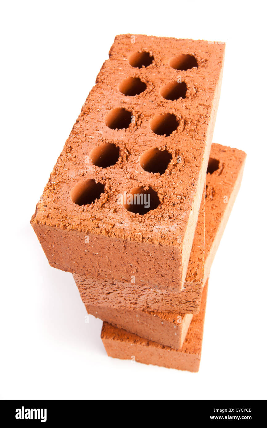 Four clay bricks being stacked Stock Photo - Alamy