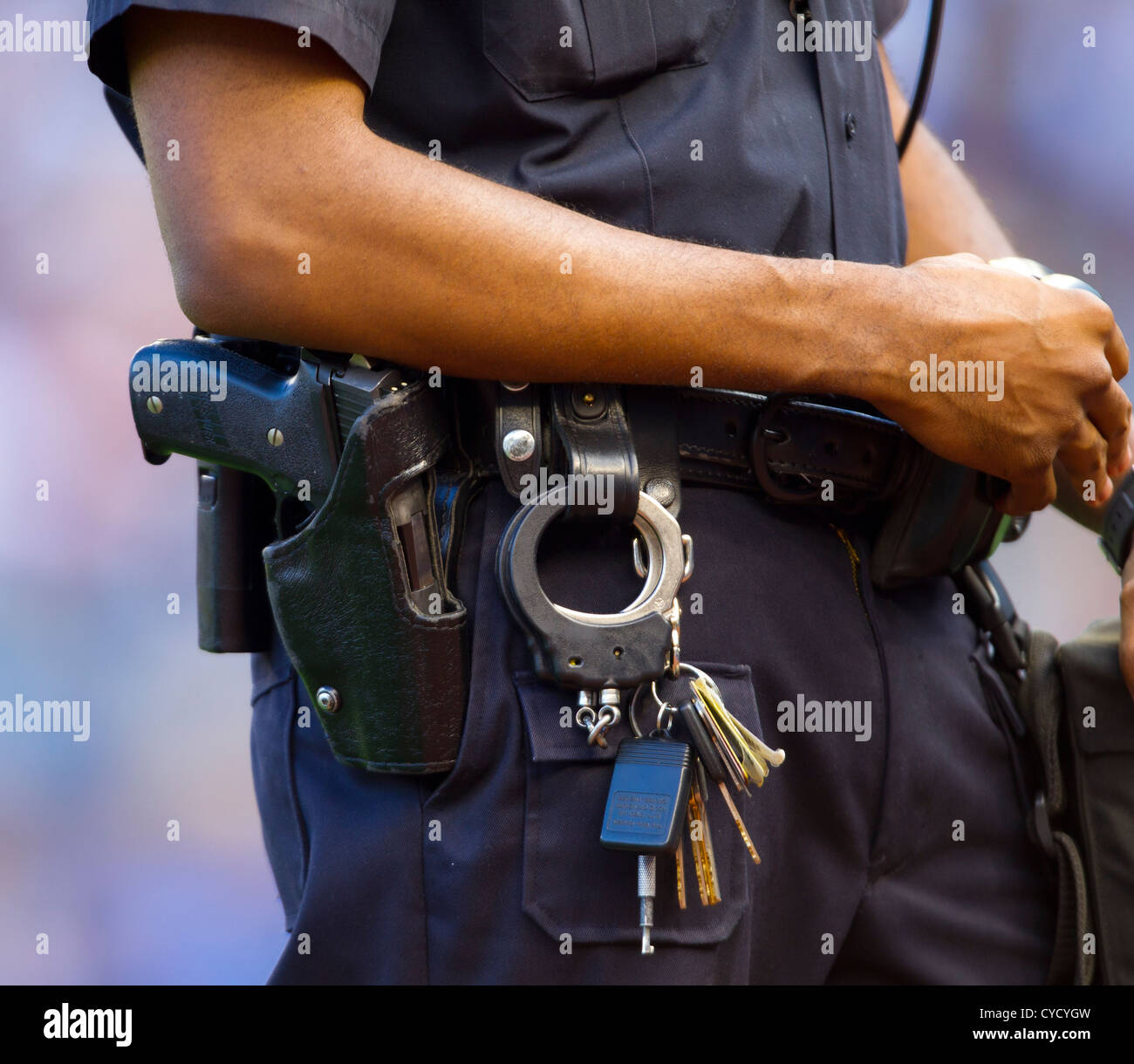 A closeup of a New York City policeman with handcuffs and pistol Stock ...