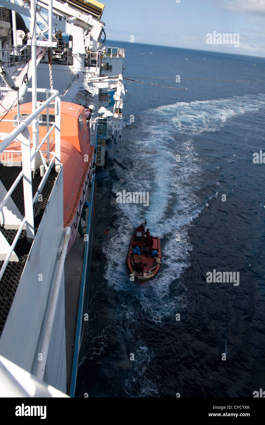 Work boat of the seismic vessel CGG Alize coming along side to be ...
