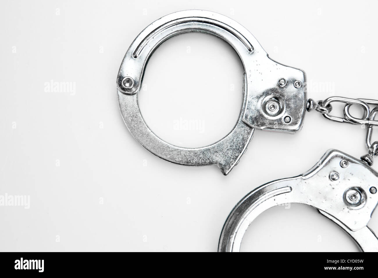 Silver manacles lying Stock Photo - Alamy