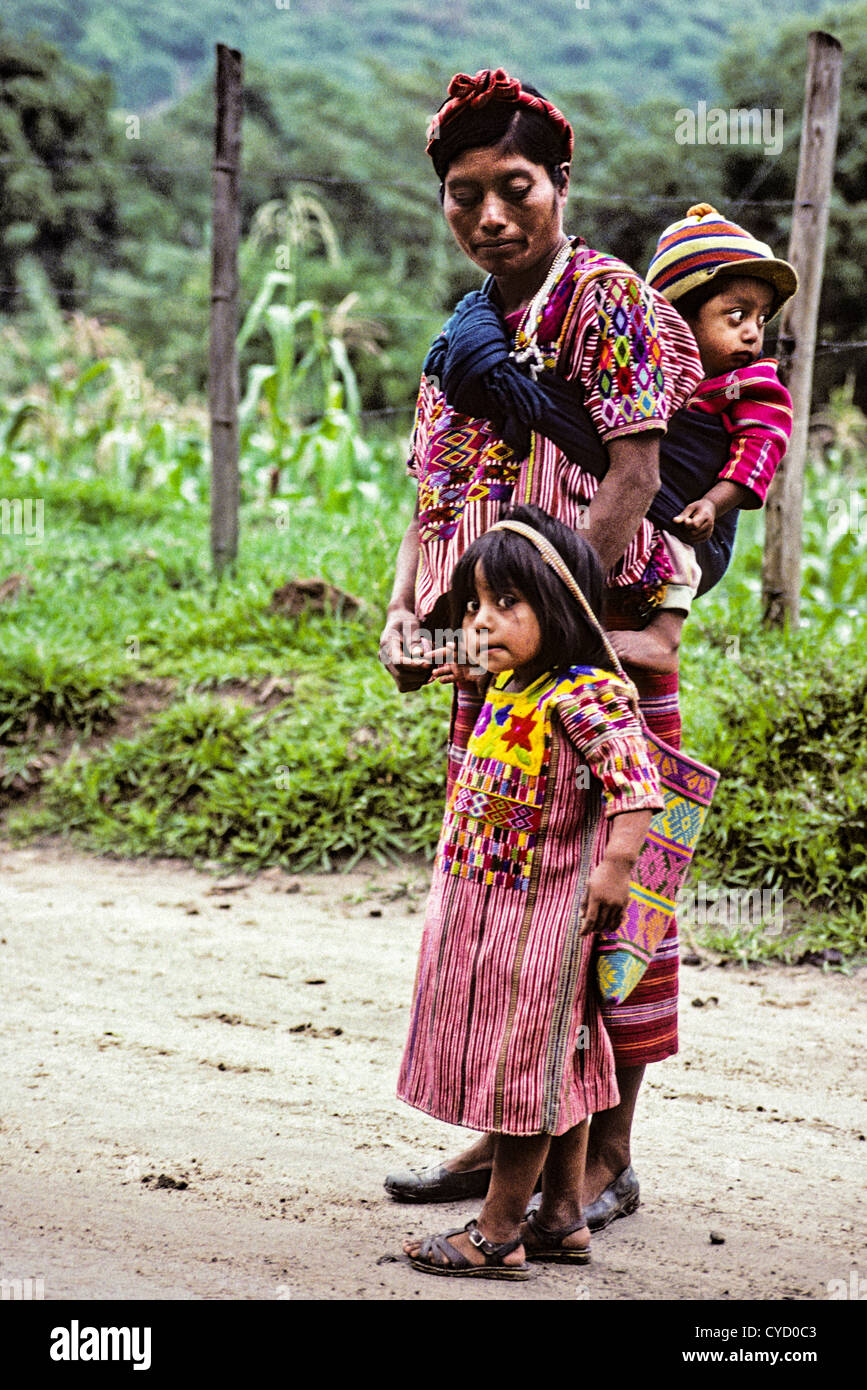 Guatemalan Mam mother and her two children, a young girl and baby boy ...