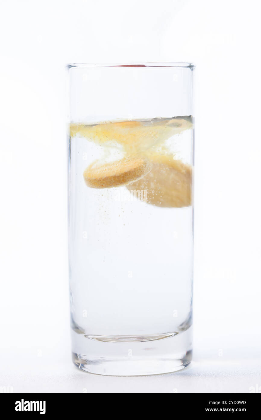 Vitamin tablet dissolving in water Stock Photo - Alamy