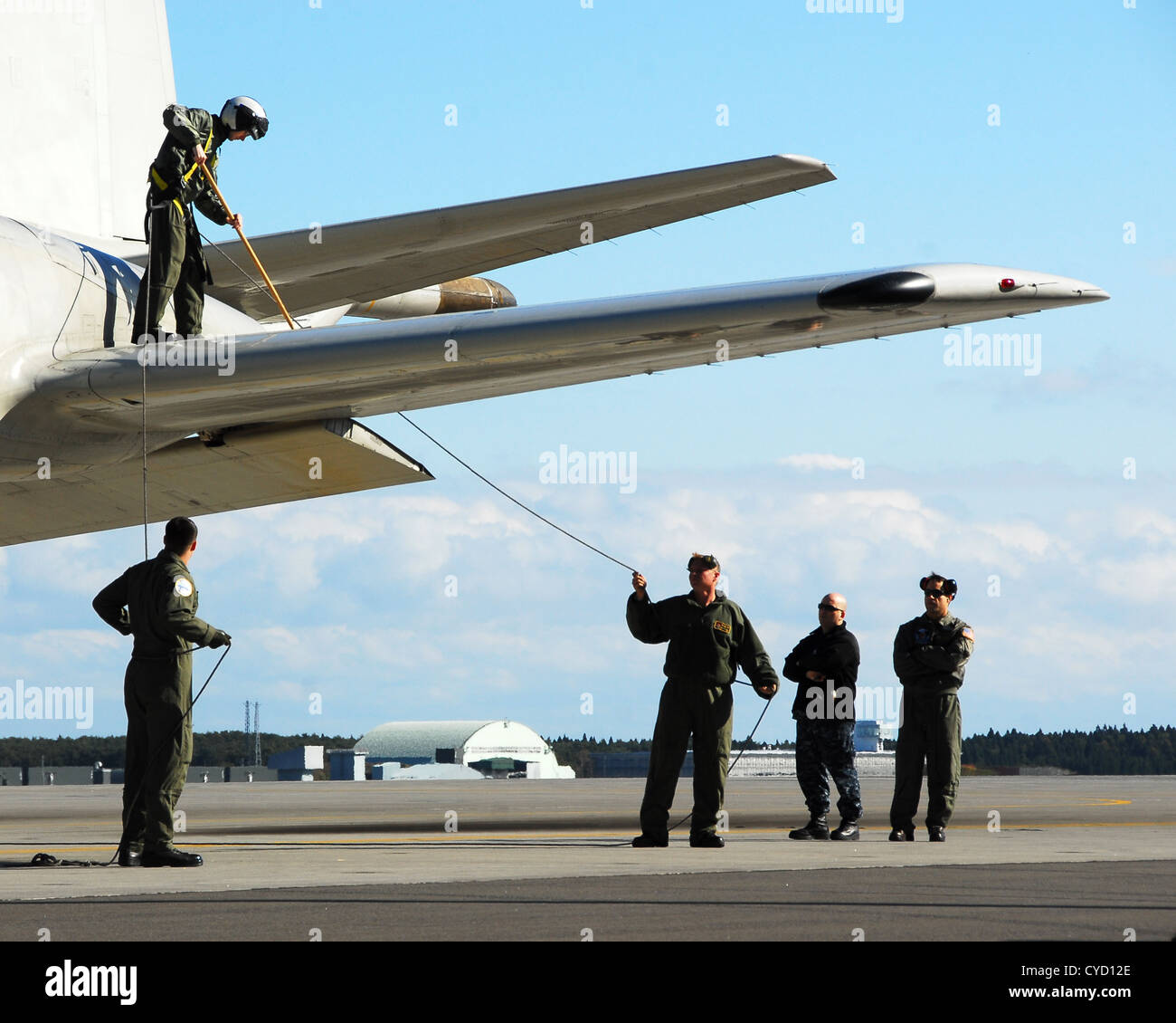 Naval Aircrewman (Operator) 3rd Class Samuel Woolard, top, assigned to ...