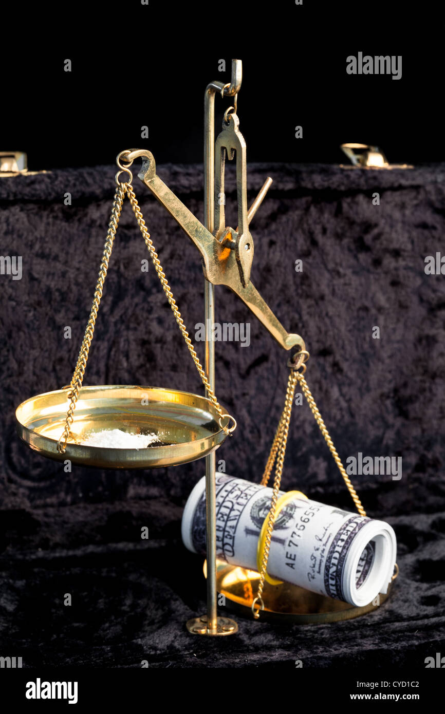 The balance between drugs and money Stock Photo - Alamy