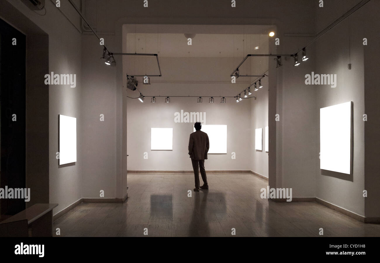 People looking photo exhibit hi-res stock photography and images - Alamy