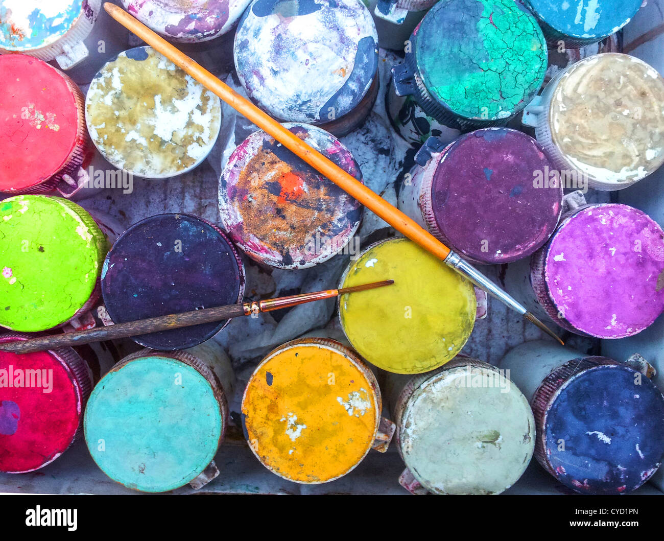 Messy box with used paintbrushes and watercolors Stock Photo - Alamy