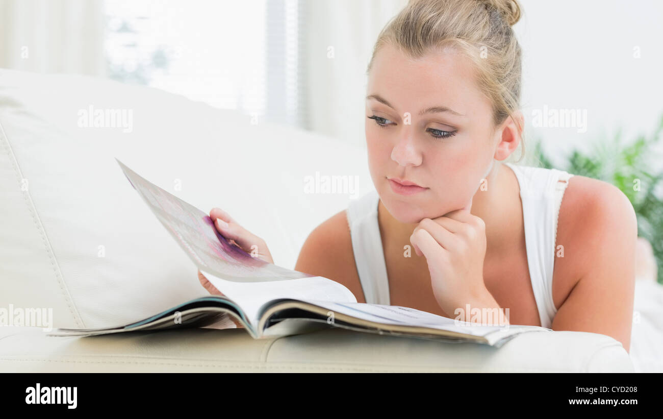 Woman reading a magazine Stock Photo - Alamy