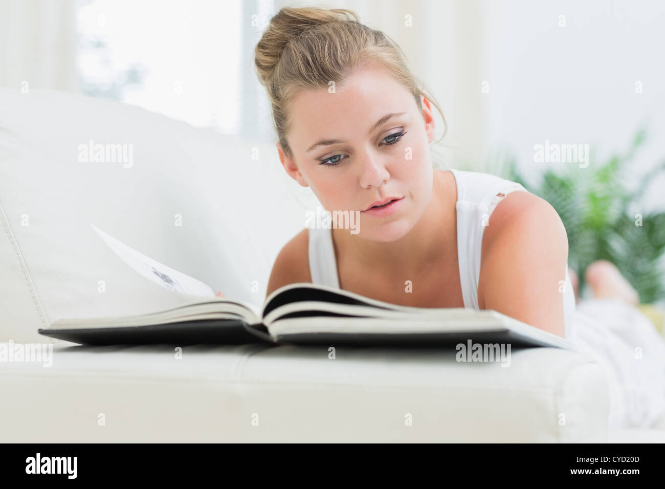Woman reading the magazine Stock Photo - Alamy