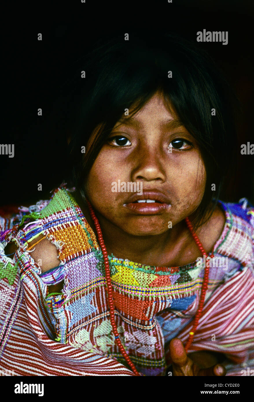 Young Mayan girl in Guatemala wearing a worn huipil Stock Photo - Alamy