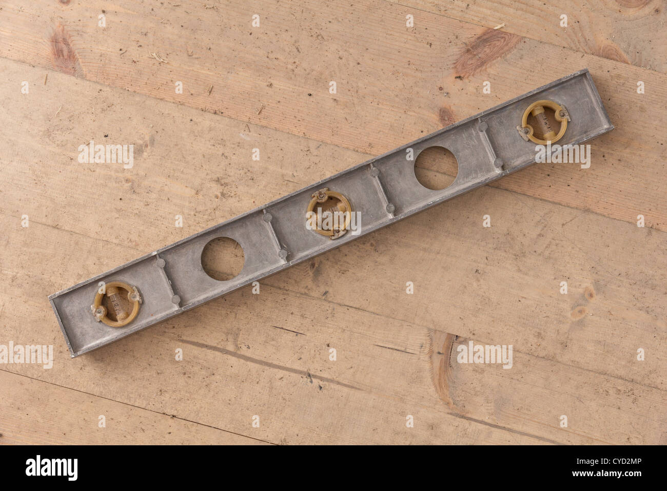 old builder's level laying on wood floor Stock Photo - Alamy