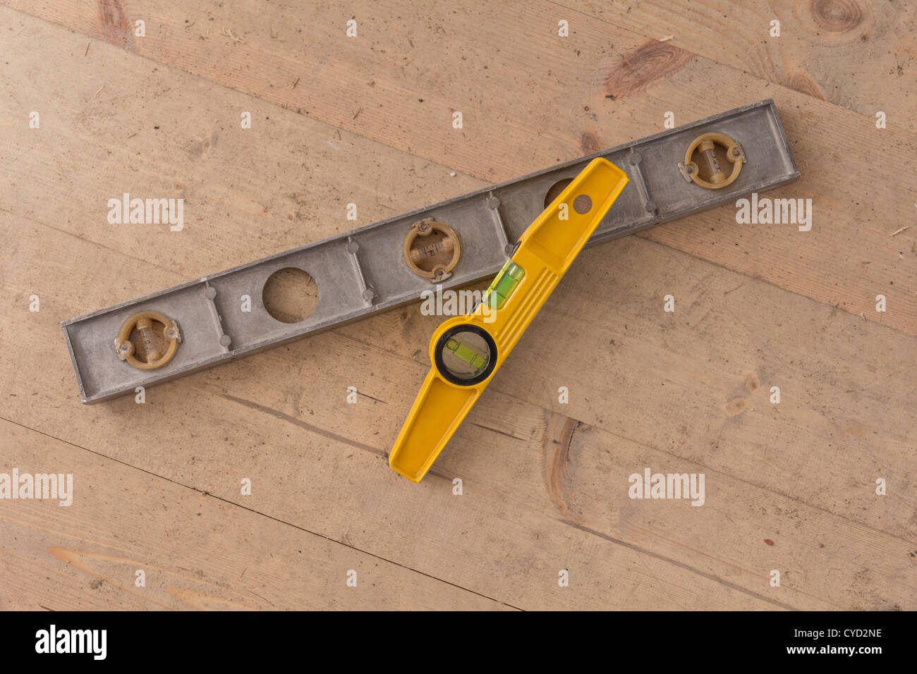 old and new builder's levels laying on wood floor Stock Photo - Alamy