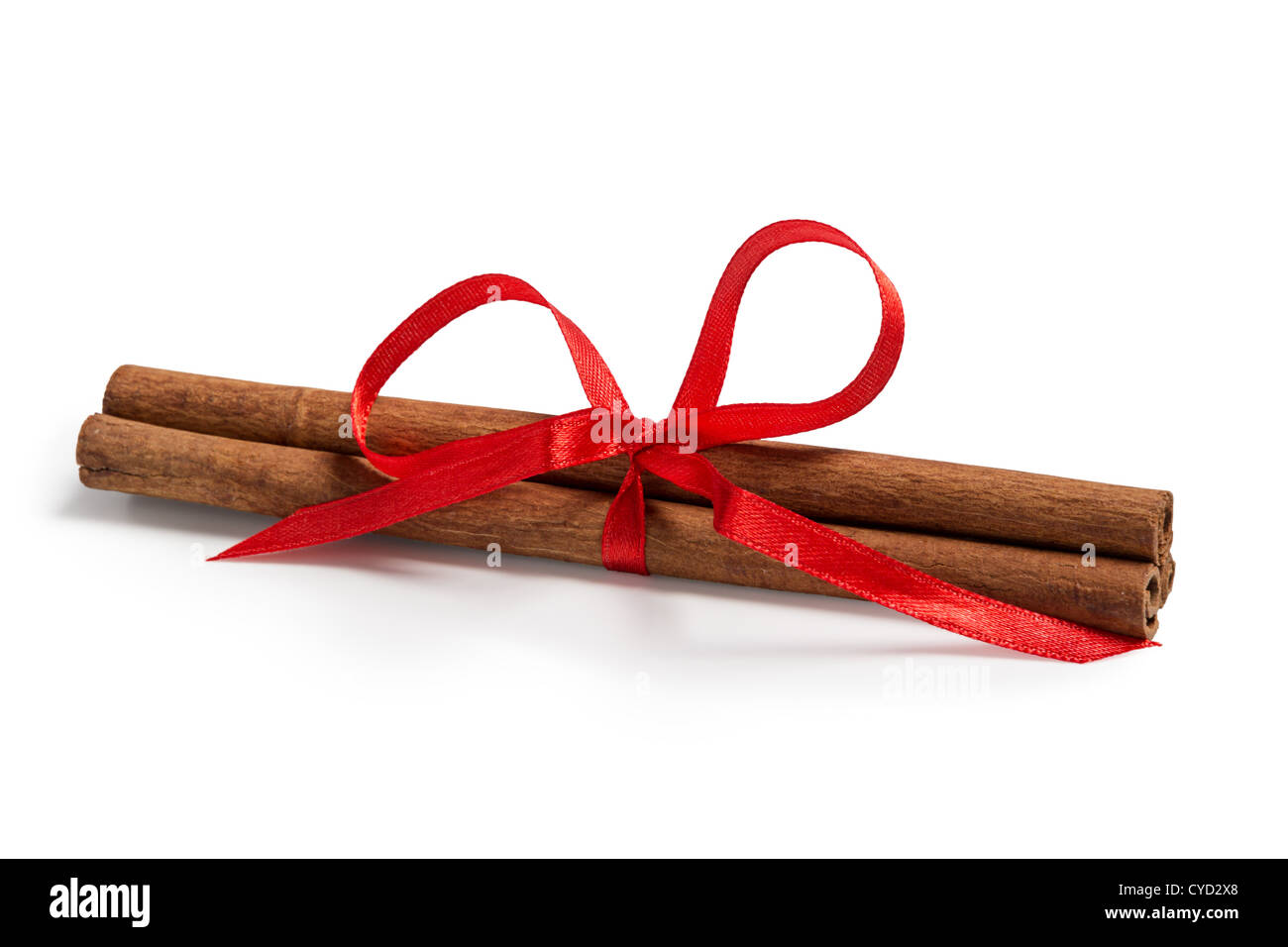 sticks of cinnamon with ribbon bow isolated on white Stock Photo - Alamy