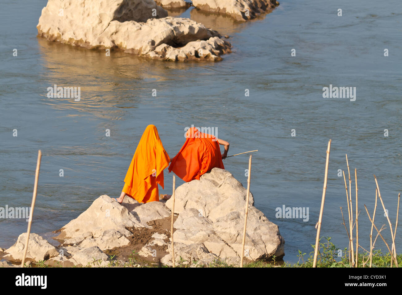 Monks fishing in the River Mekong in Luang Prabang, Laos Stock Photo ...