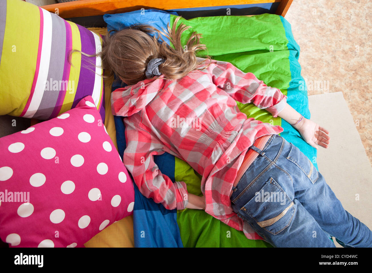 Teen girl frustration crying lying on the bed Stock Photo - Alamy
