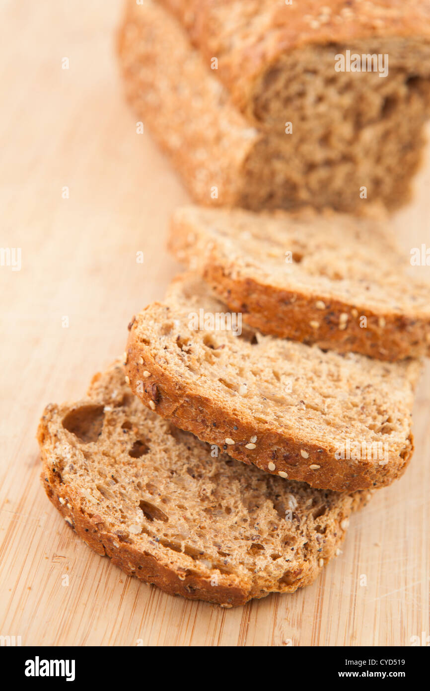 Partially sliced brown bread Stock Photo - Alamy
