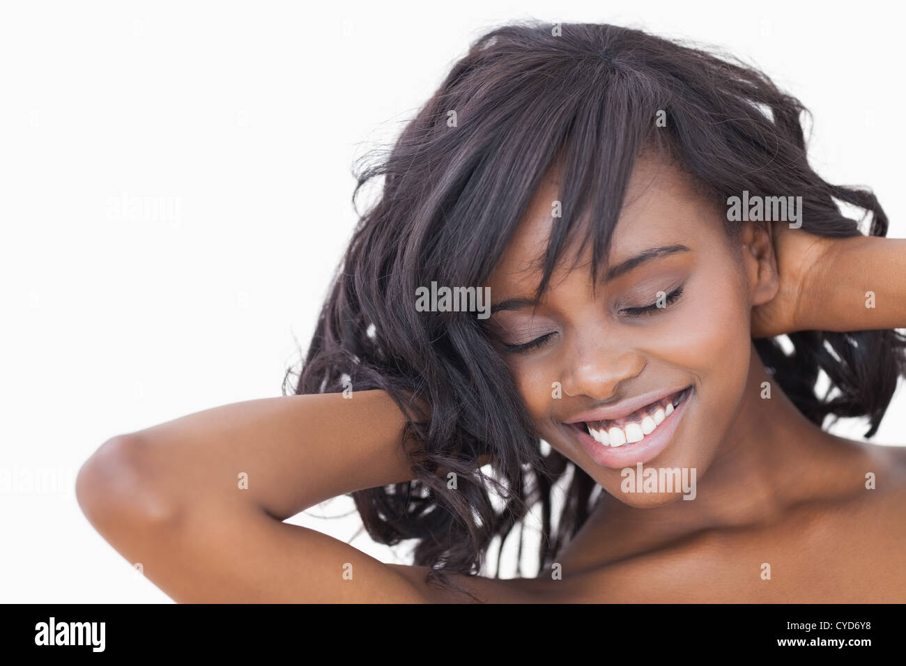 Woman ruffling her hair Stock Photo - Alamy