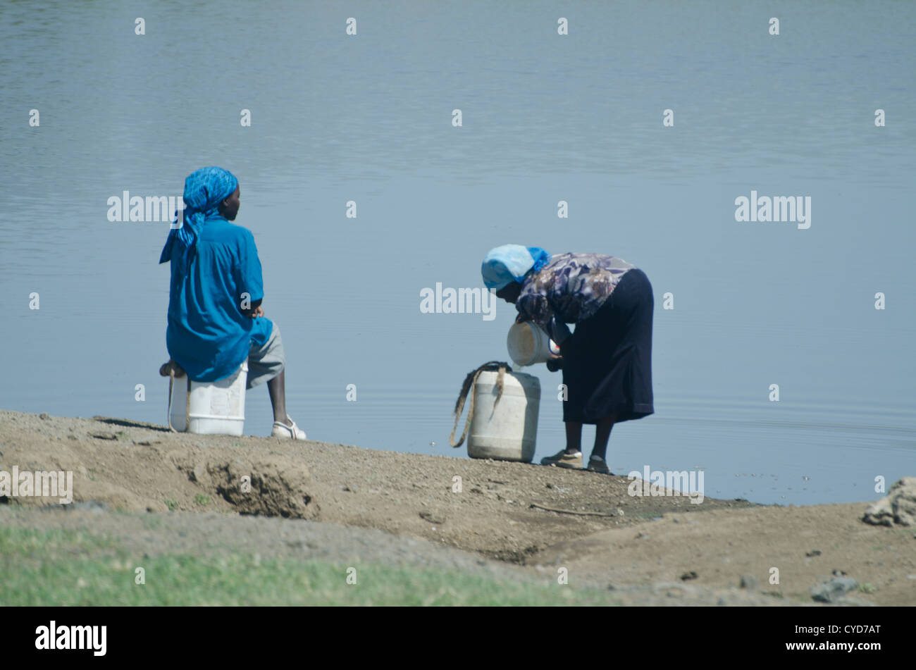 African women collecting water from pond in Kenya Stock Photo - Alamy