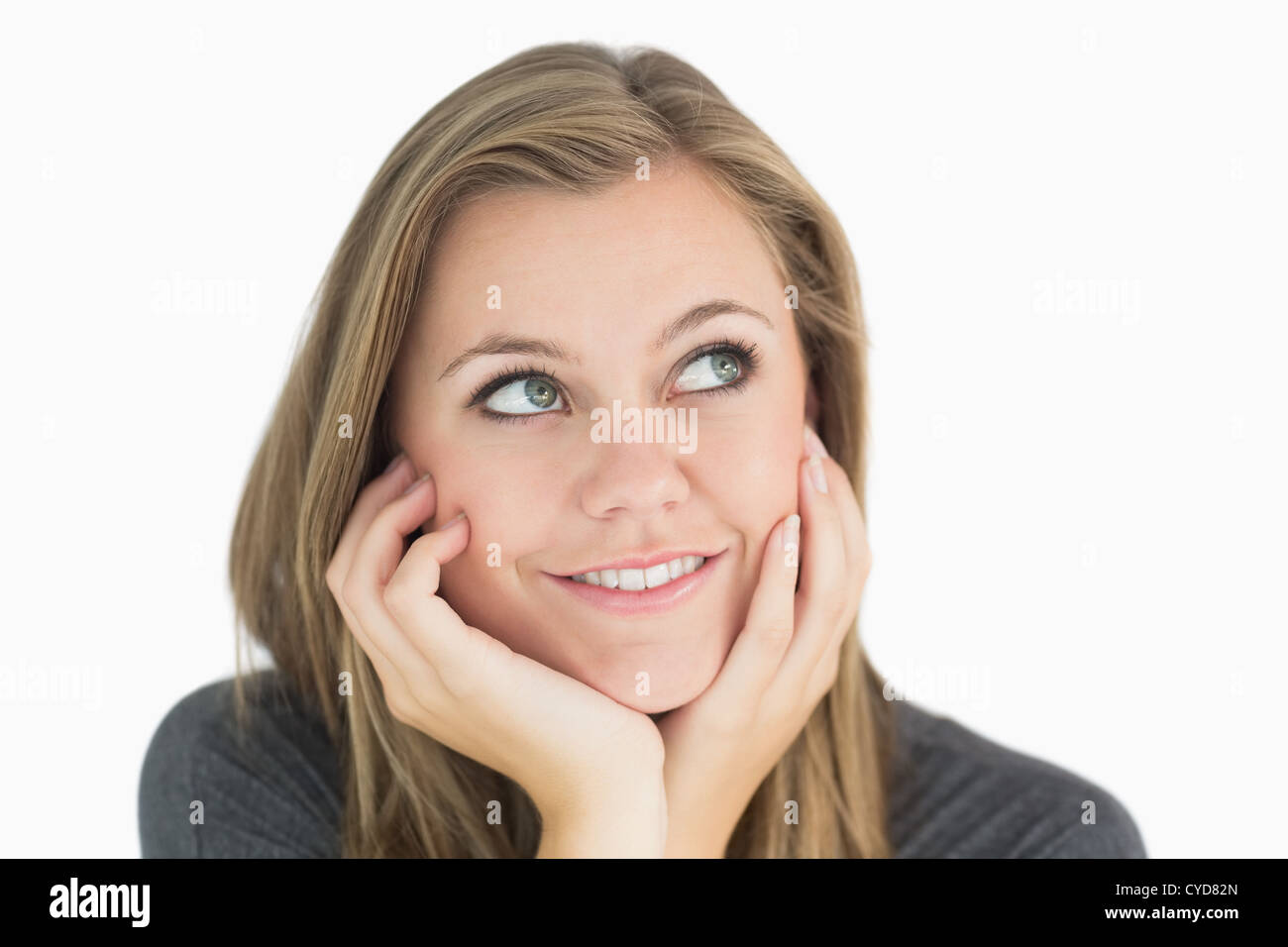 Thoughtful woman smiling Stock Photo - Alamy