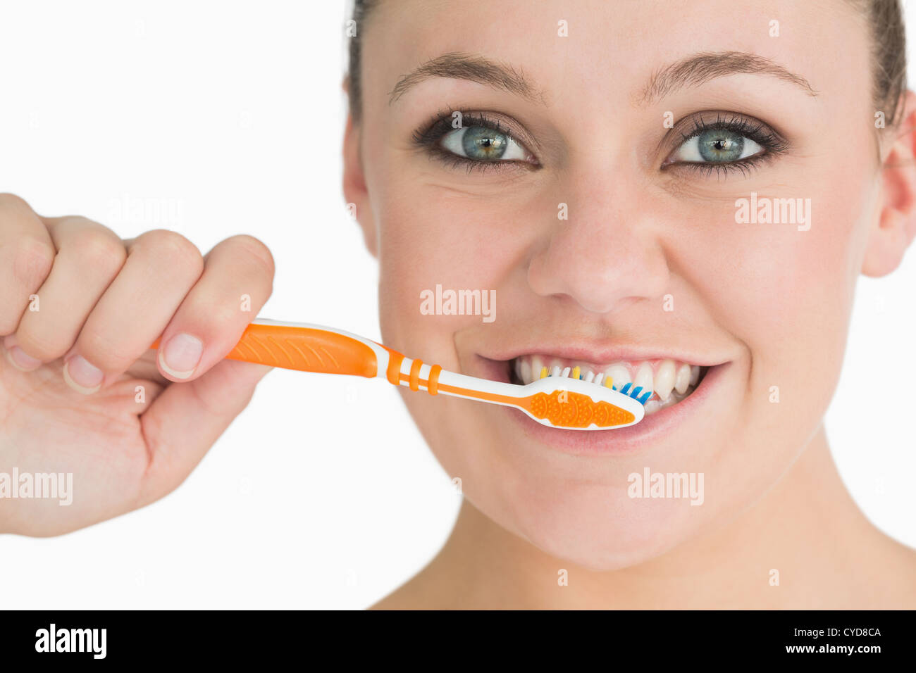 Happy woman washing her teeth Stock Photo - Alamy
