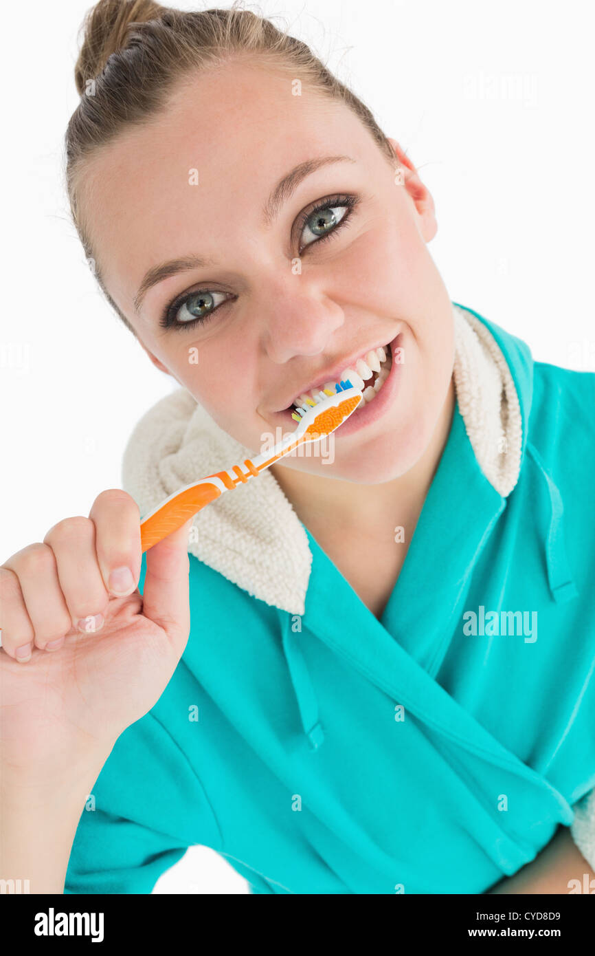 Woman with bathrobe washing her teeth Stock Photo - Alamy