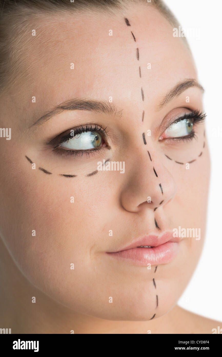 Blonde with marker on her face for facelift Stock Photo - Alamy