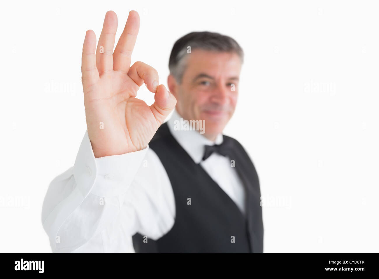 Happy waiter making OK sign Stock Photo - Alamy