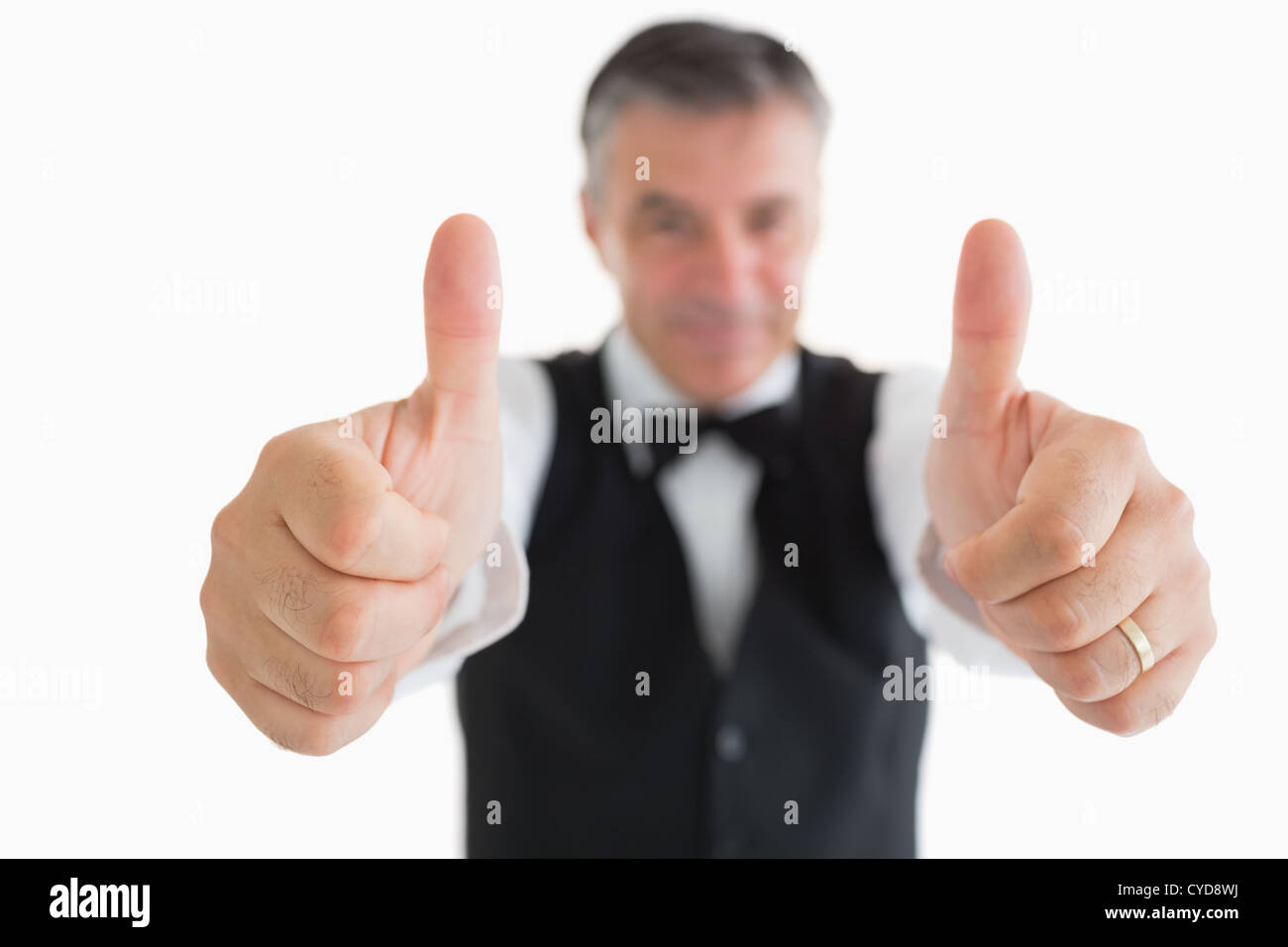 Cheerful waiter having thumbs up Stock Photo - Alamy