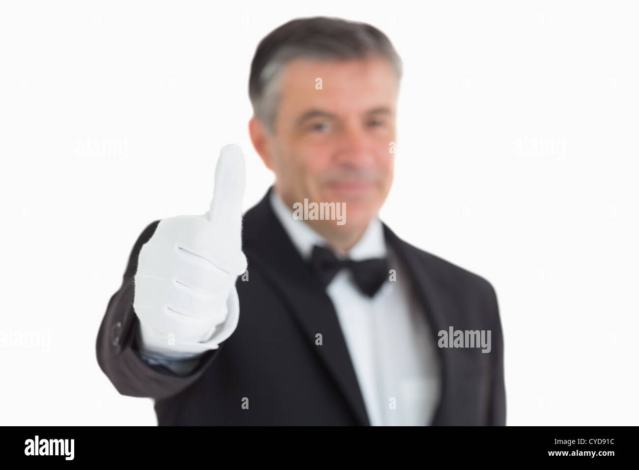 Glad waiter having thumbs up Stock Photo - Alamy
